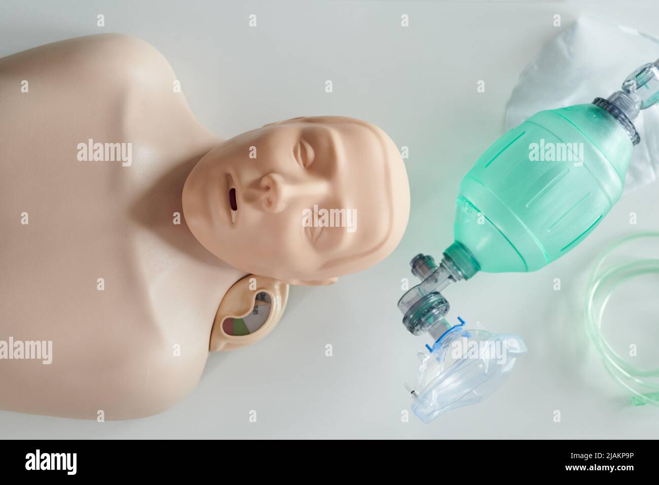 High angle view of training dummy and oxygen mask used by paramedic ...
