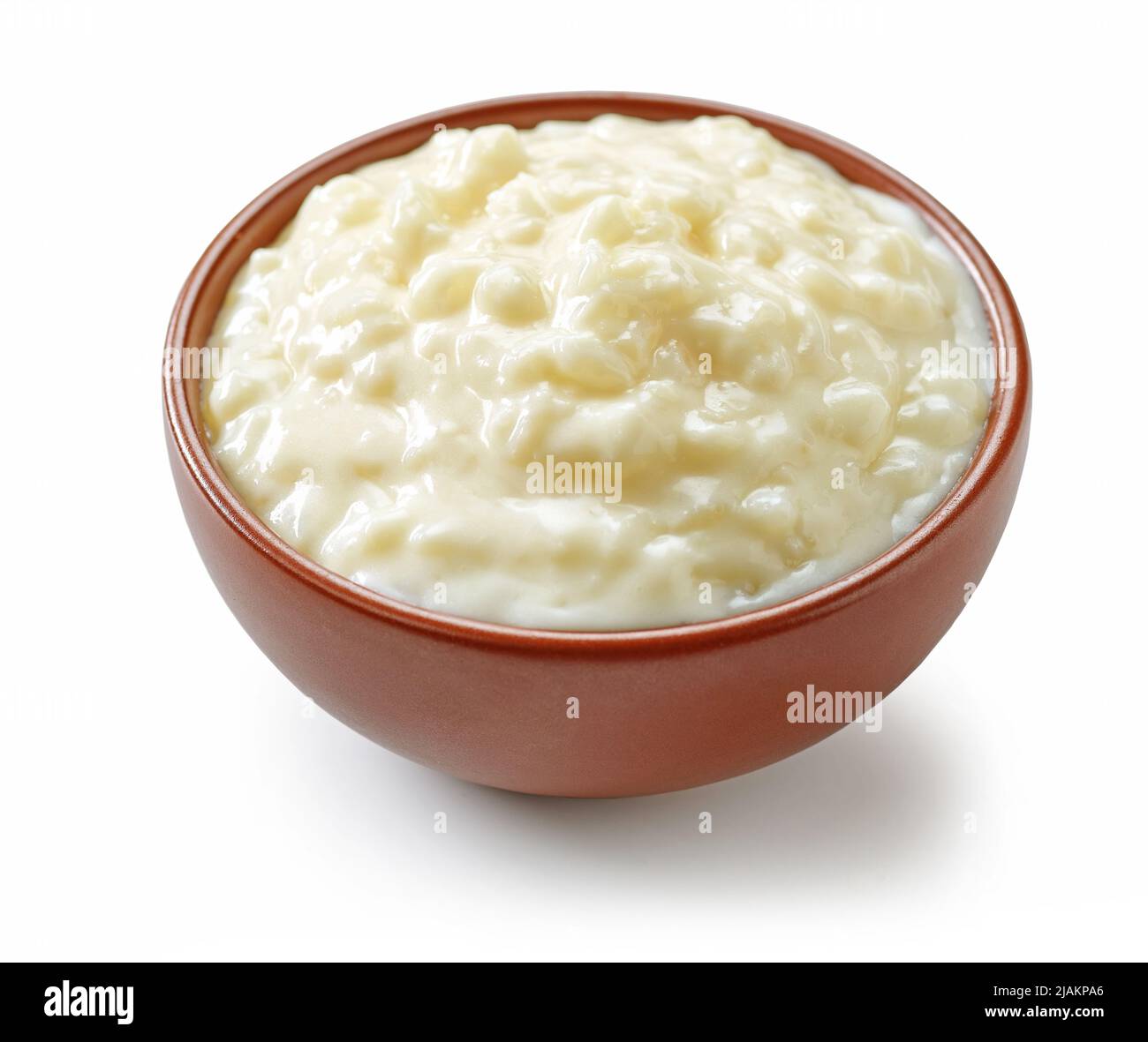 bowl of rice pudding isolated on white background Stock Photo - Alamy