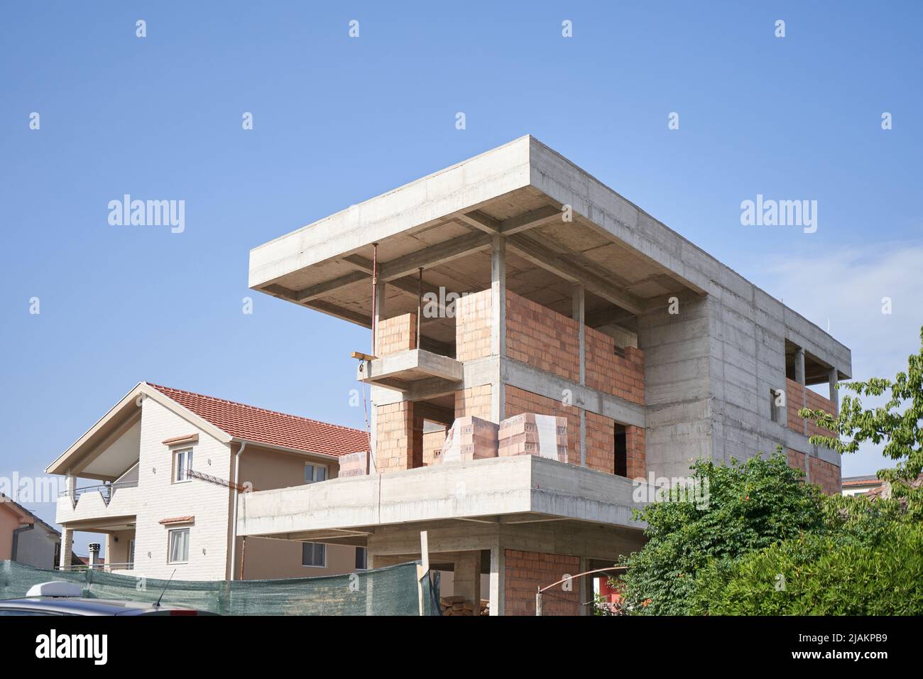 Construction of a modern house made of reinforced concrete with a flat ...
