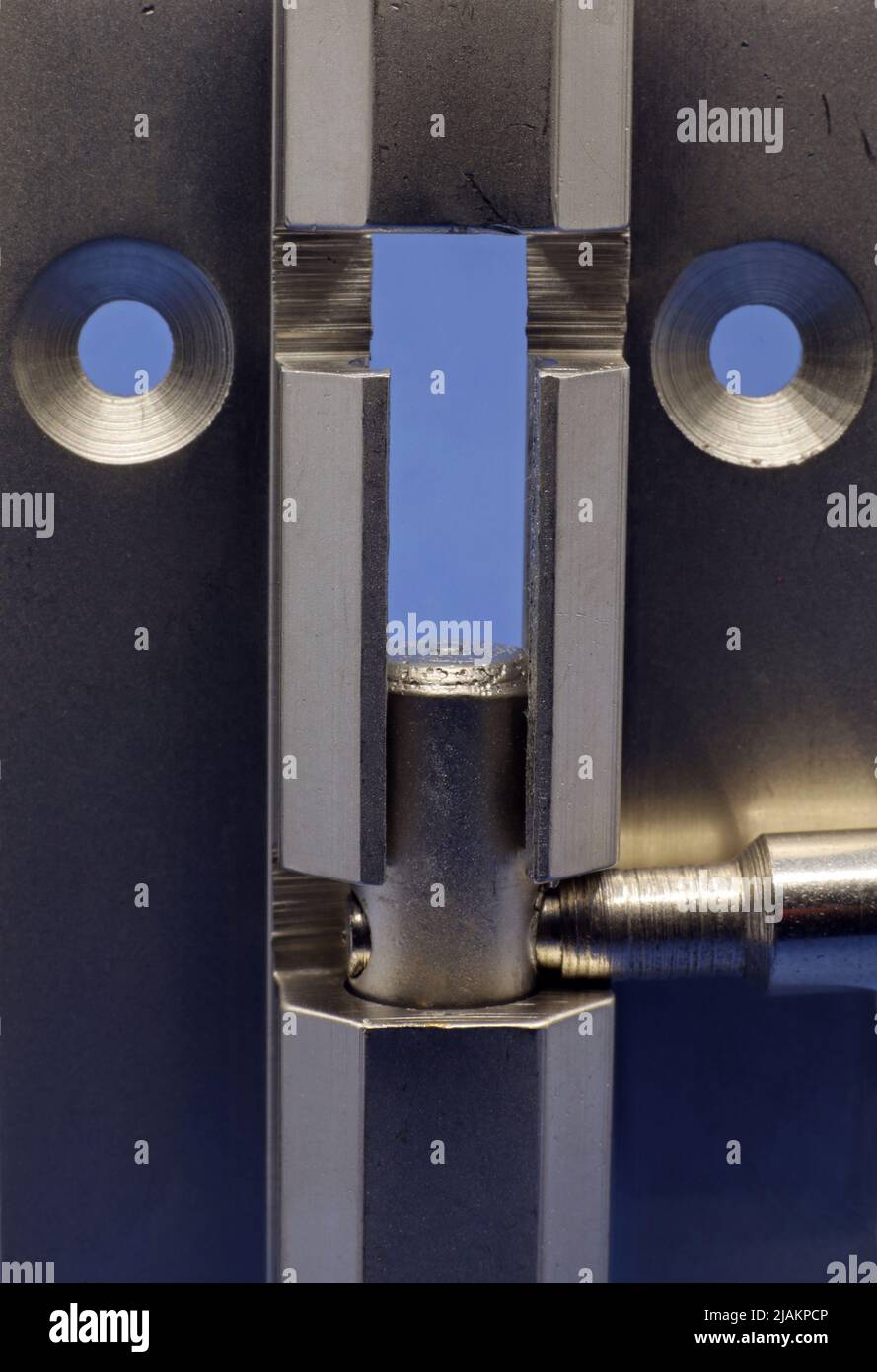 small industrial objects close-up on a blue background Stock Photo - Alamy
