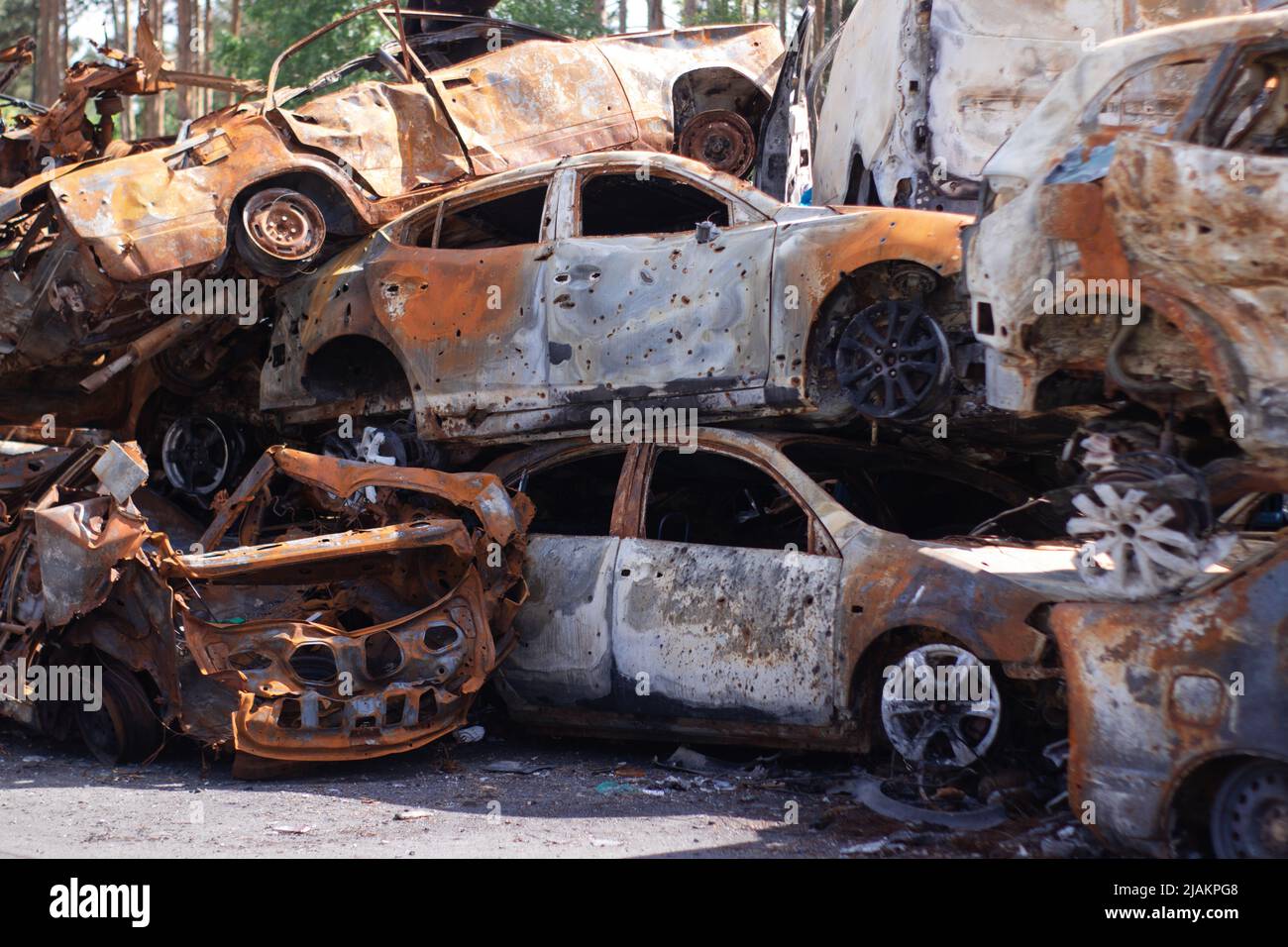rusty burnt cars in Irpen, after being shot by Russian military and ...