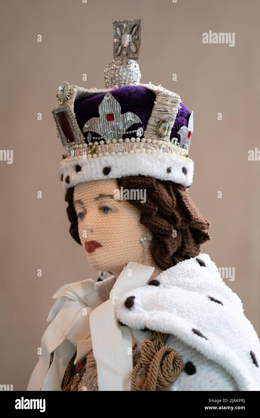 A life-size knitted model of Queen Elizabeth II at the Church of the ...