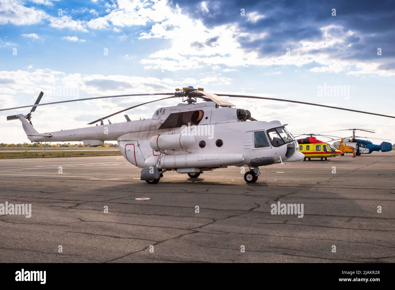 Three different helicopters at the heliport Stock Photo - Alamy