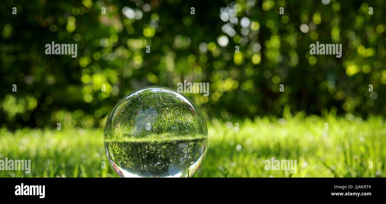 landscape with glass lens ball in the garden Stock Photo - Alamy