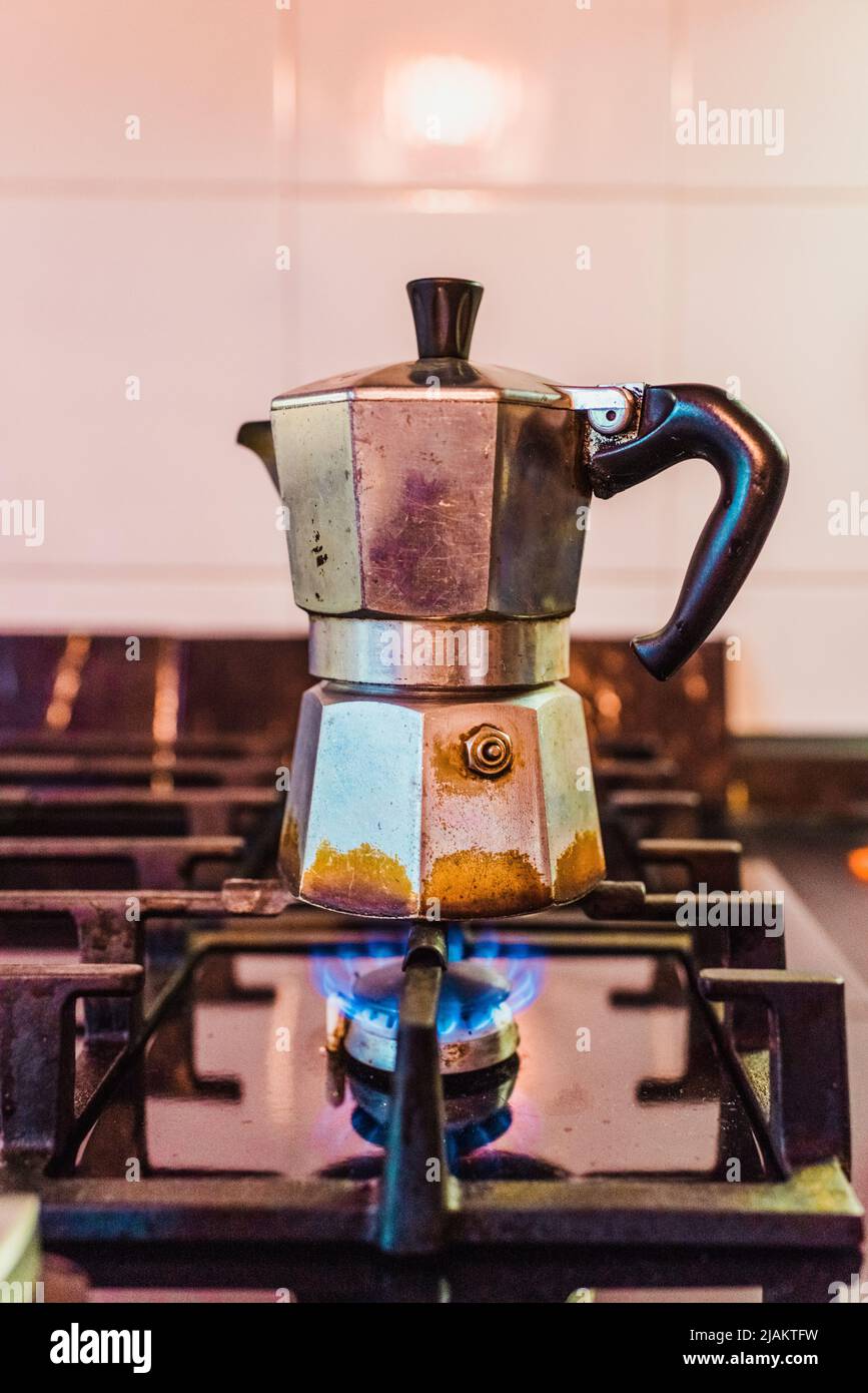 Traditional Italian aluminum coffee pot, on fire in a kitchen Stock ...