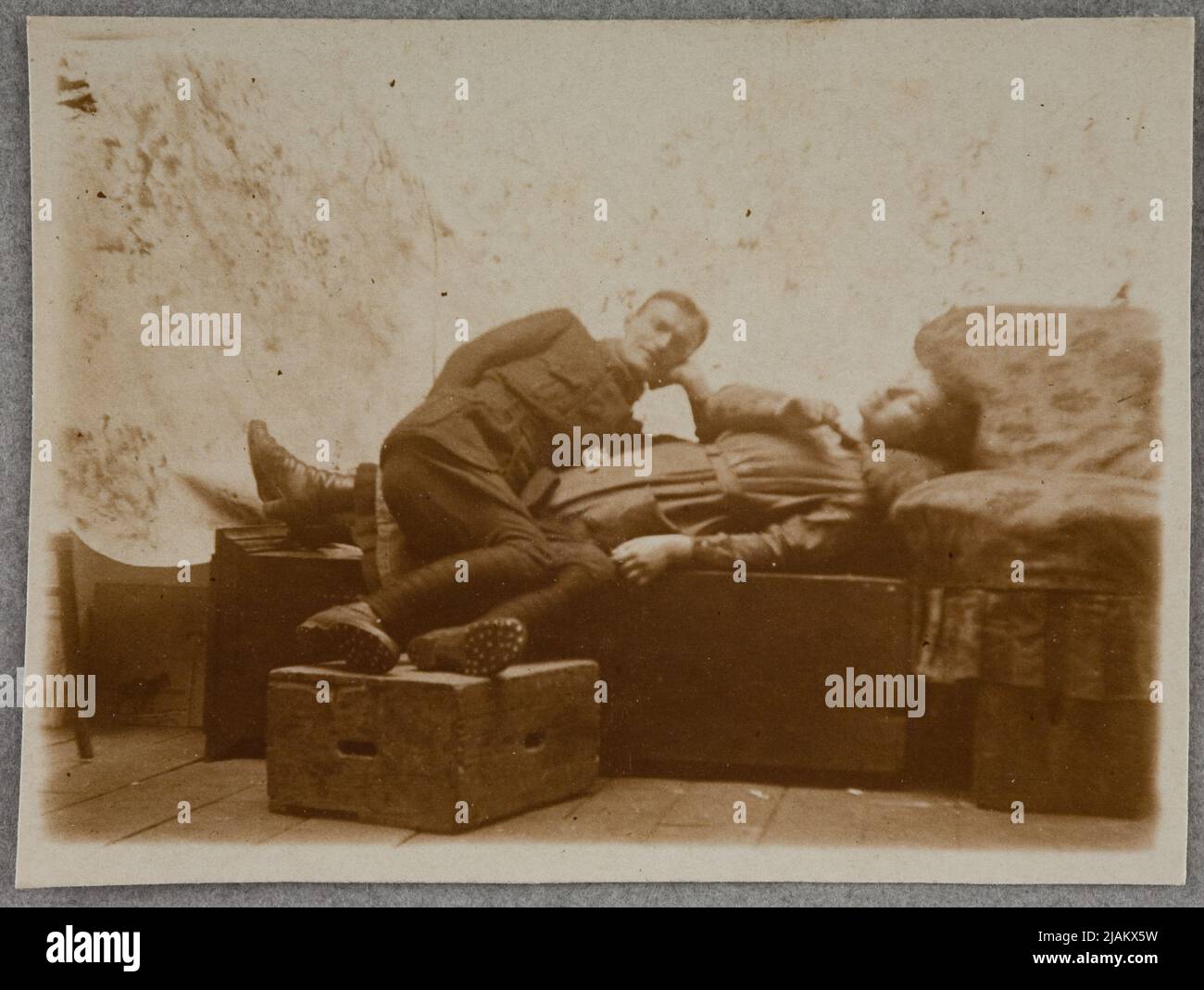 Two lying characters on a chest, or a wardrobe located on the floor in ...