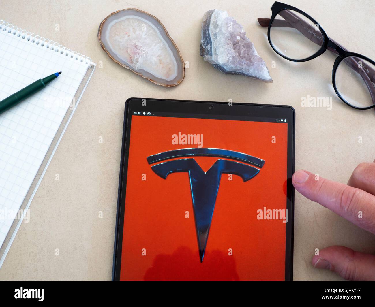 In this photo illustration Tesla, Inc. logo seen displayed on a tablet ...
