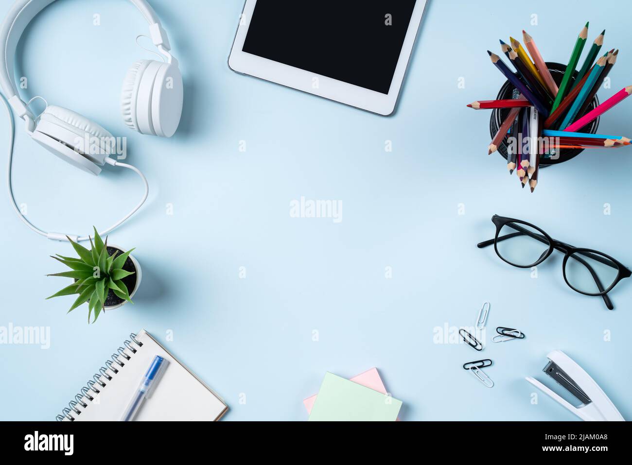 Online learning design concept. Top view of student table with tablet ...