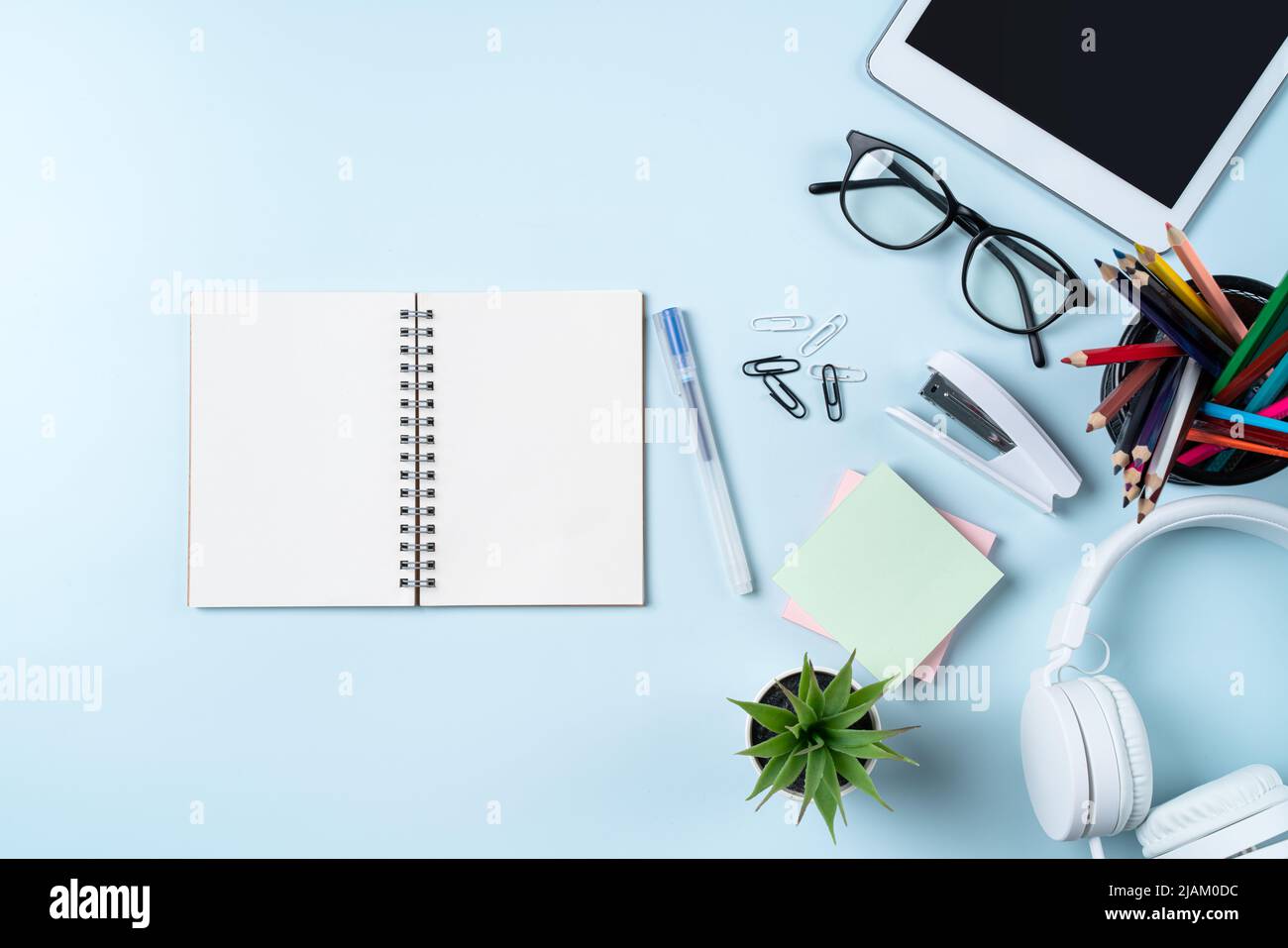 Online learning design concept. Top view of student table with tablet ...