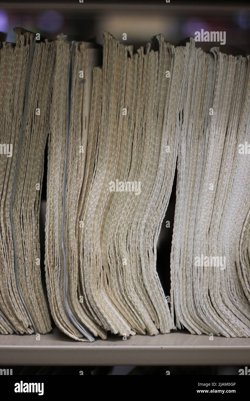 Bunch of paperwork stored on the book shelf Stock Photo - Alamy