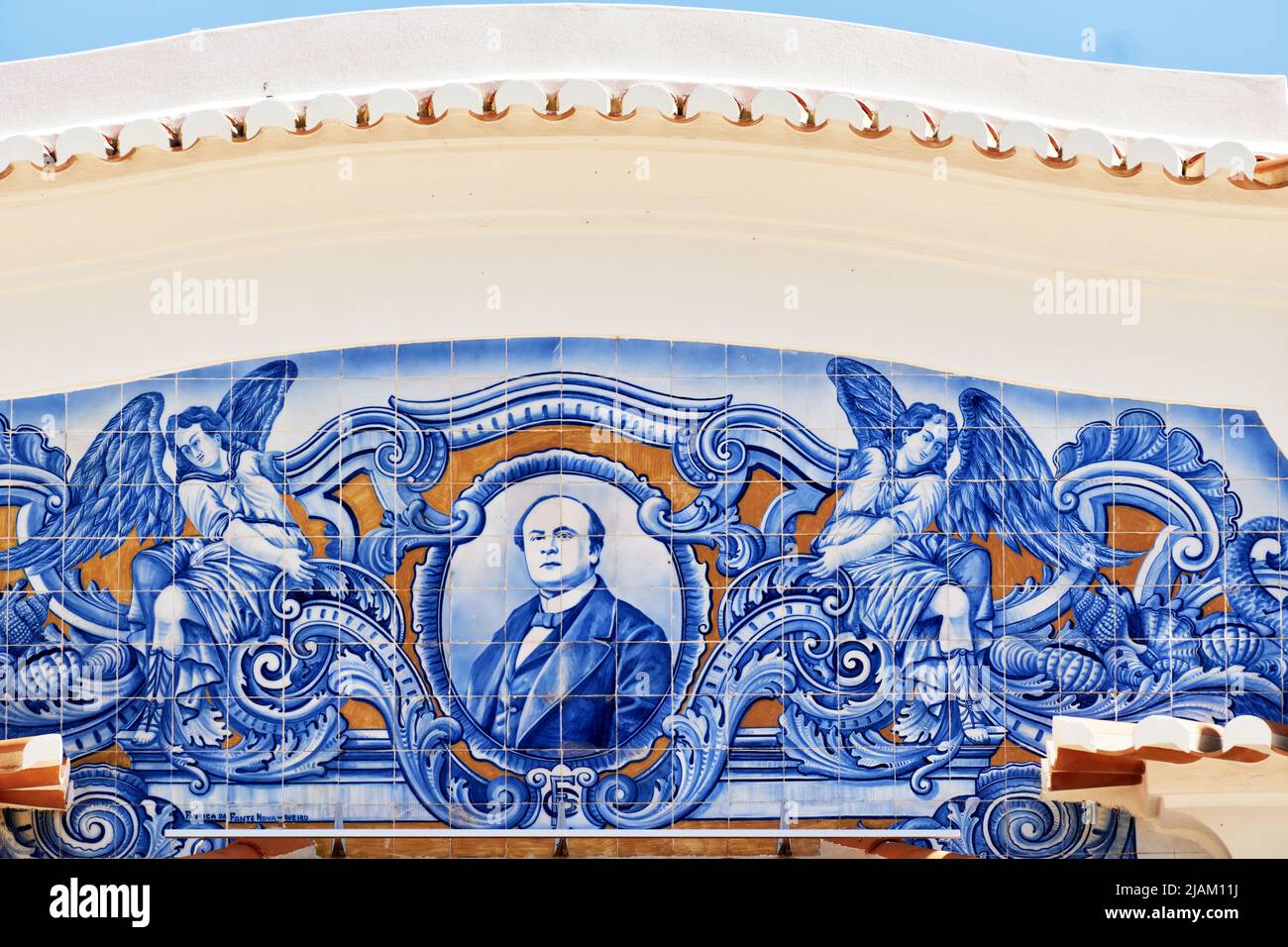 detail of a landscape on a panel of azulejos tiles on the facade of old ...