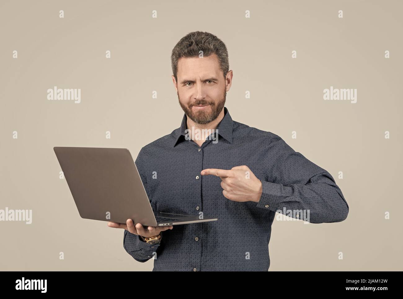 Technology you can trust. Computer engineer point finger at laptop ...