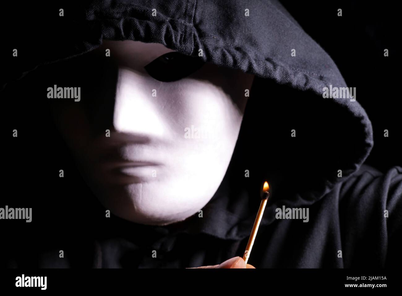 masked man on dark background Stock Photo - Alamy