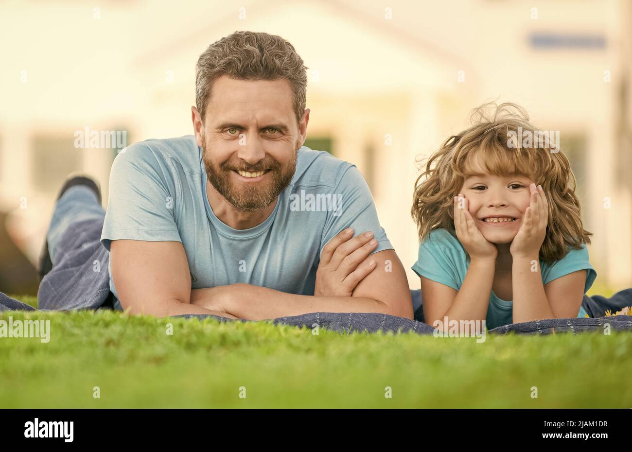 happy father with child relax together on green park grass, family ...