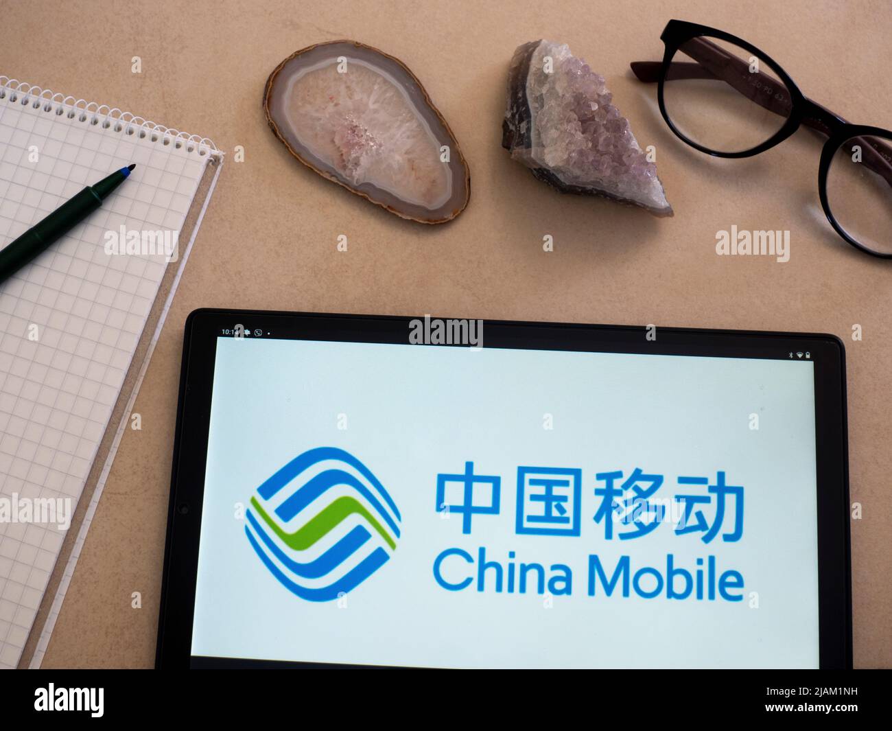 In this photo illustration China Mobile Limited logo seen displayed on ...