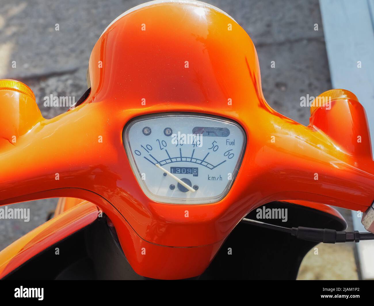 Fragment of an orange steering wheel of a motorcycle shining in the sun ... Fragment of an orange steering wheel of a motorcycle shining in the sun ...