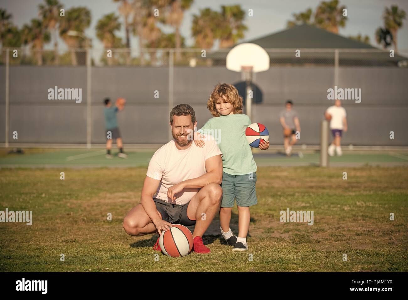 happy daddy and son playing basketball with ball outdoor, fathers day ...