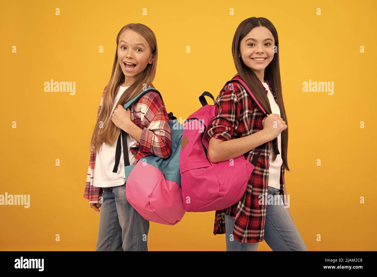 happy teen girls carry backpack. back to school. knowledge day. concept ...