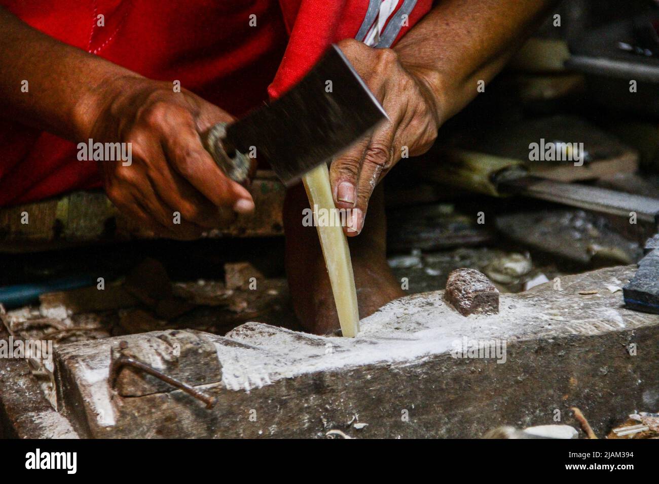 Idin makes handicrafts of cigarette pipes from cow bones in Cileunyi ...