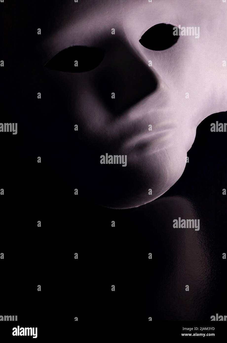 white mask isolated on black background Stock Photo - Alamy