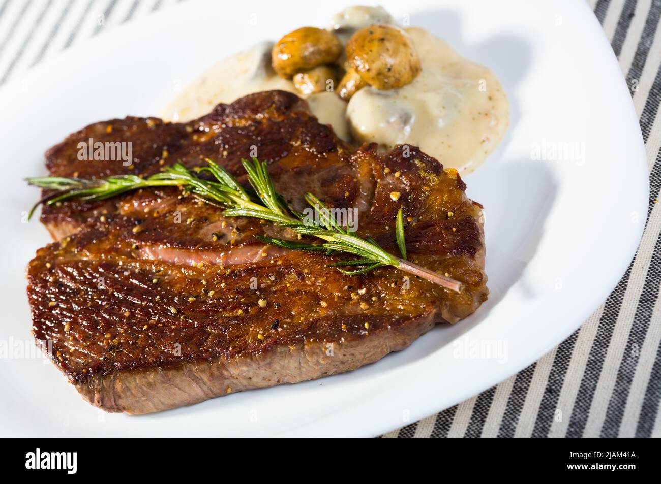 Grilled veal loin with mushroom sauce Stock Photo - Alamy