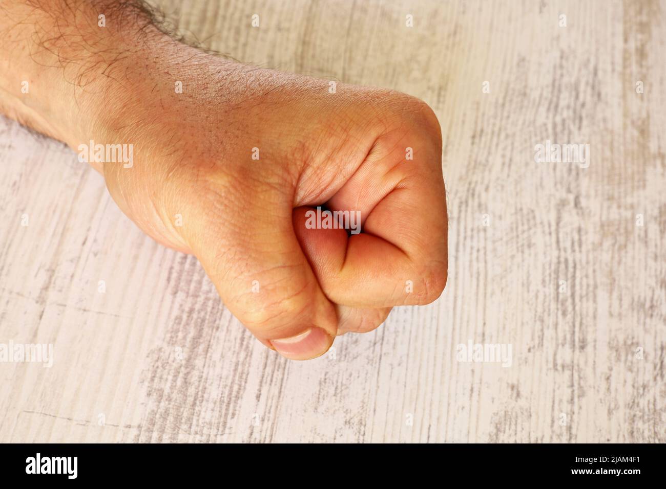 a man's hand on the table Stock Photo - Alamy