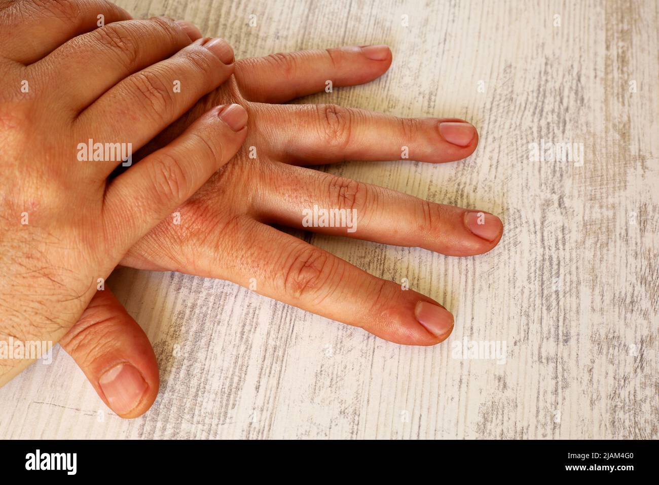 a man's hand on the table Stock Photo - Alamy