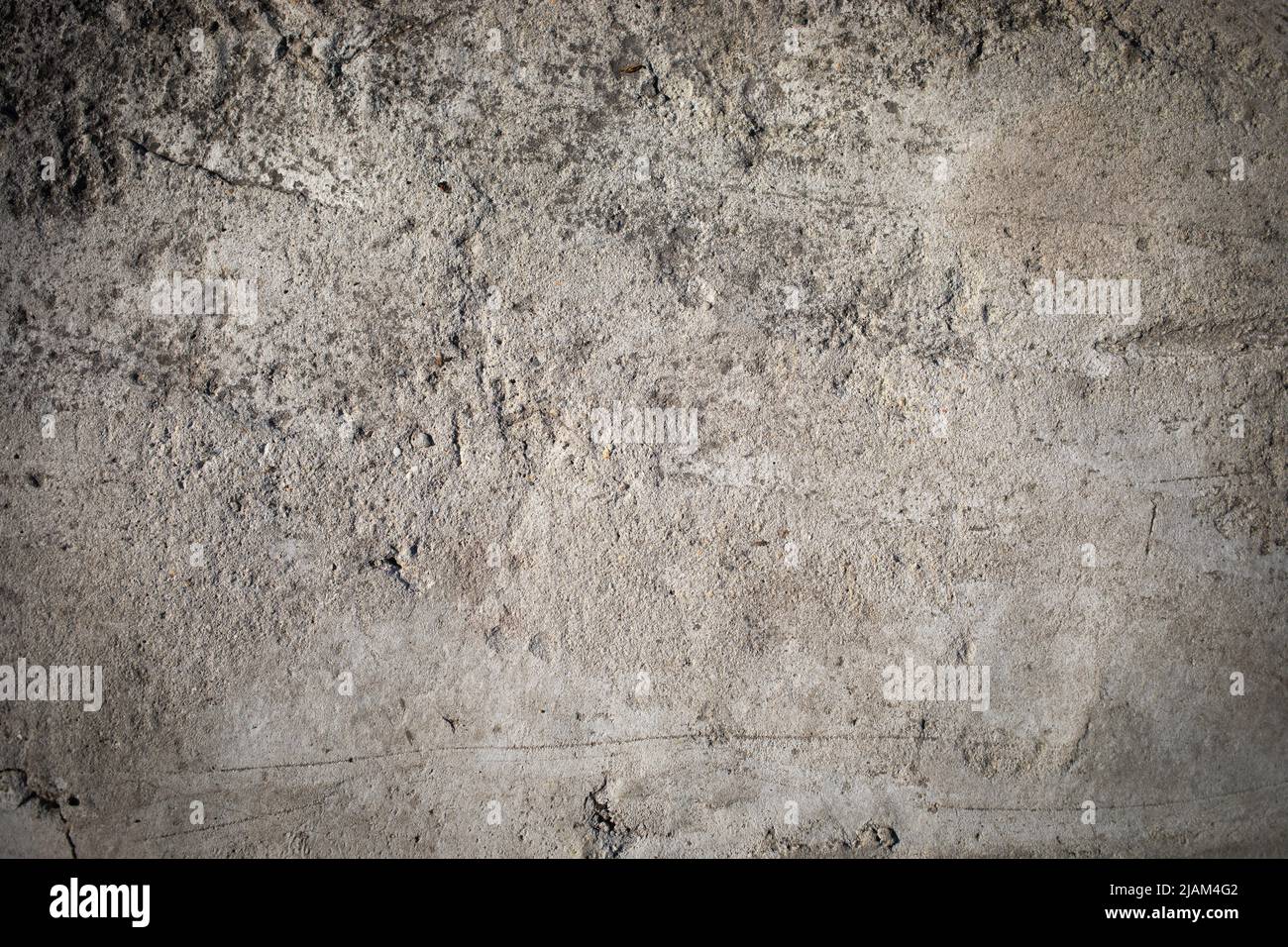 Gray-brown grunge concrete wall background. Heterogeneous rough texture ...