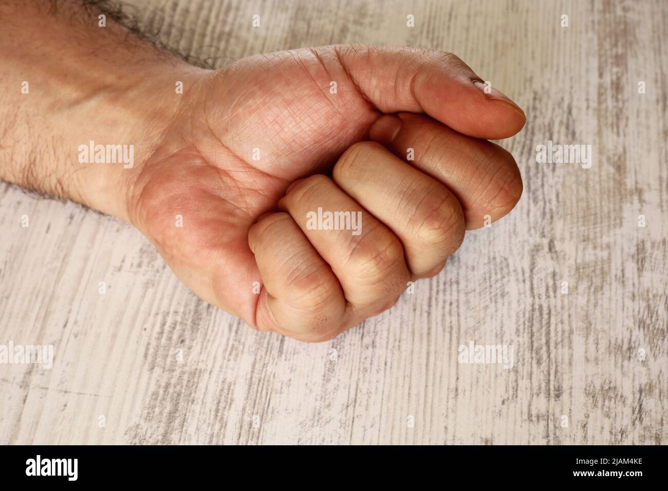 a man's hand on the table Stock Photo - Alamy