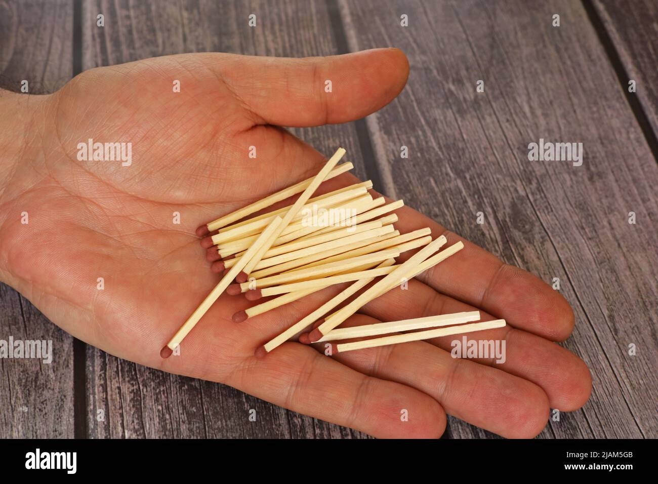 Match sticks in a hand hi-res stock photography and images - Alamy