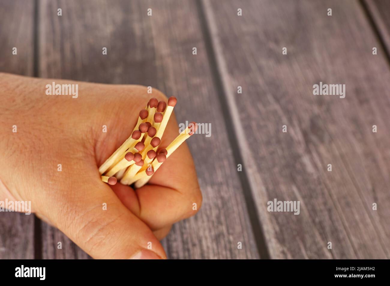 Match sticks in a hand hi-res stock photography and images - Alamy