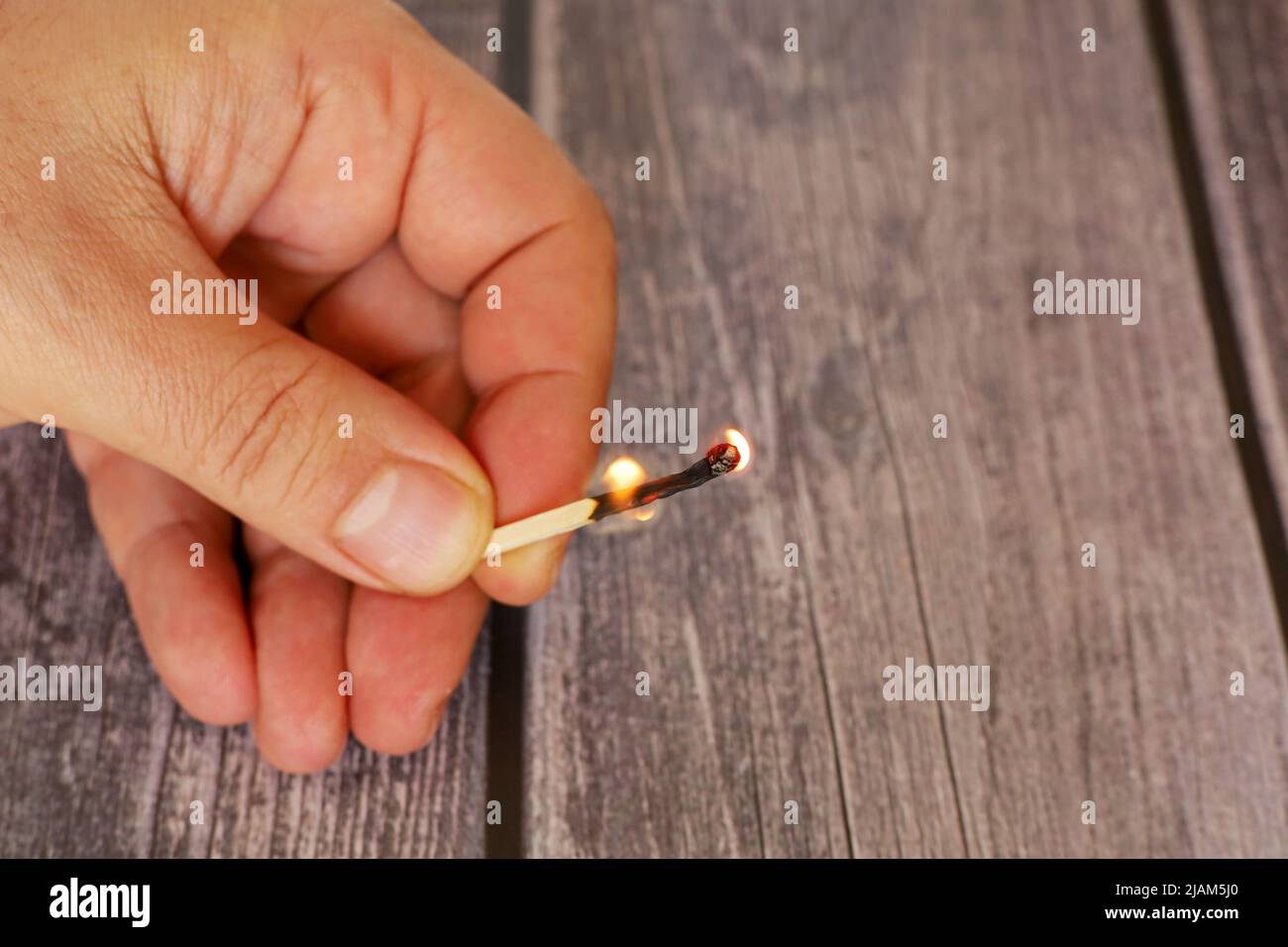 Match sticks in a hand hi-res stock photography and images - Alamy