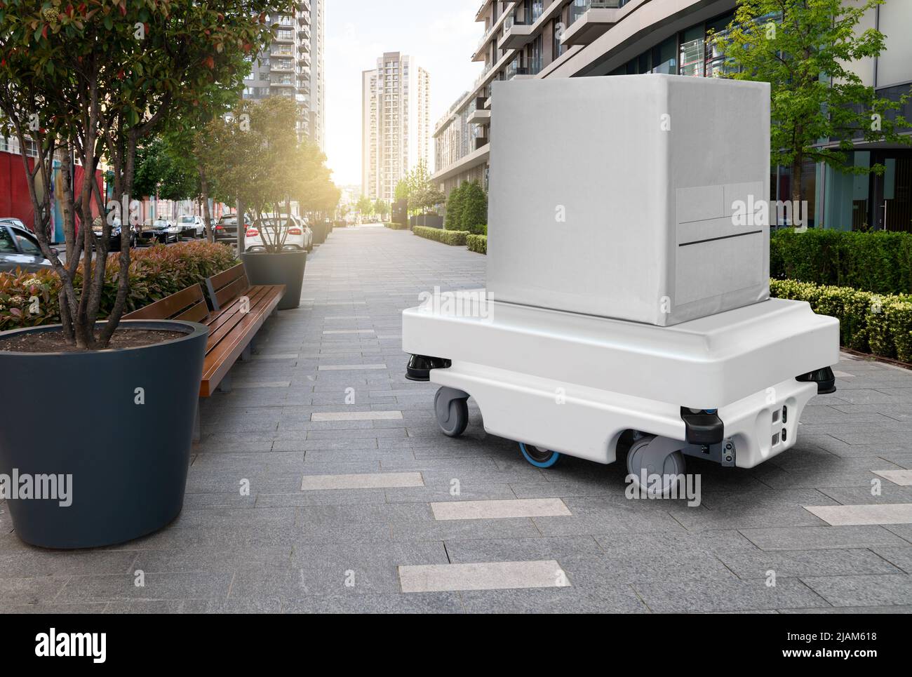 Delivery robot transporting a box on the street. Concept Stock Photo ...