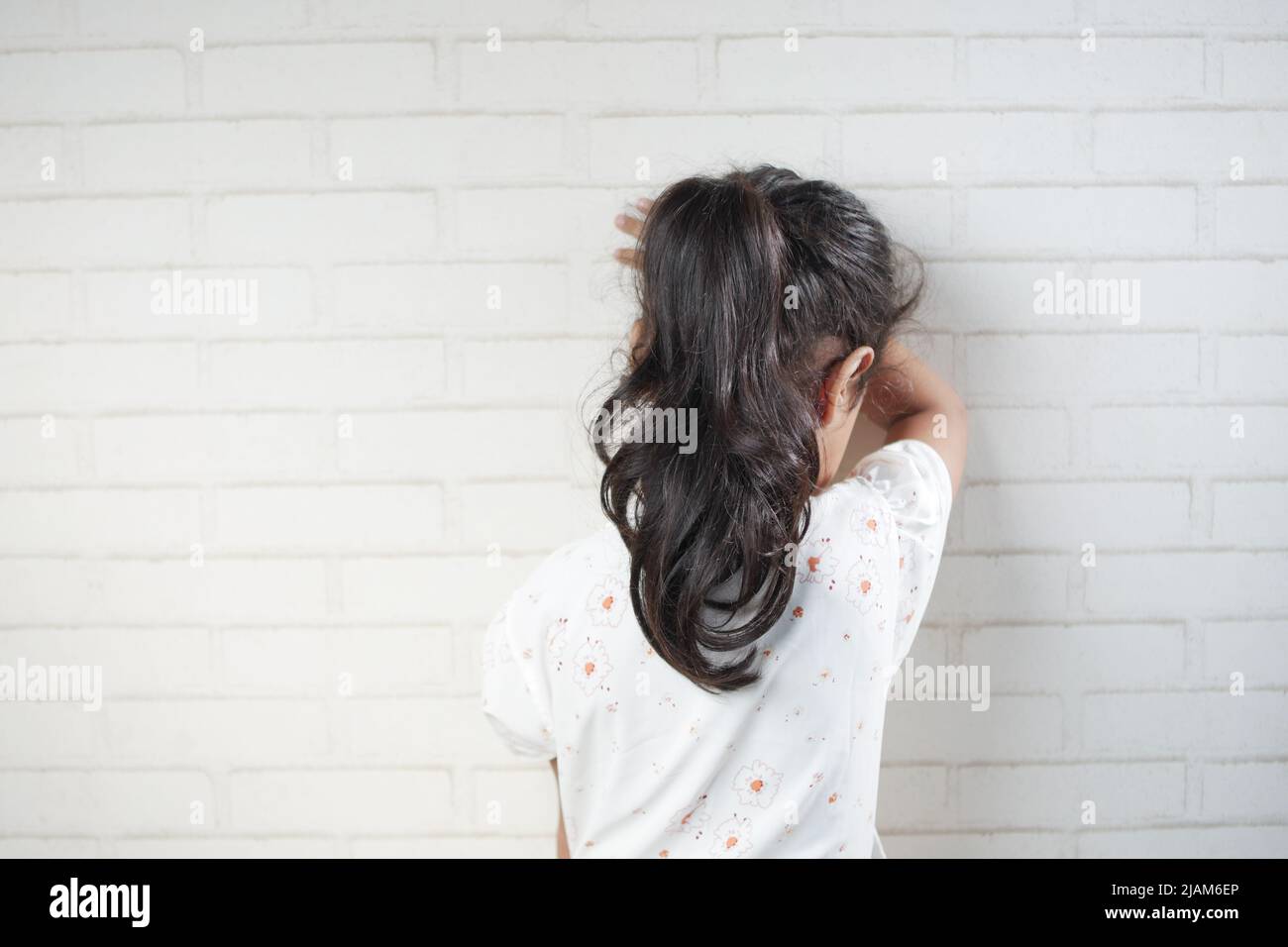 sad child child hiding her face Stock Photo - Alamy