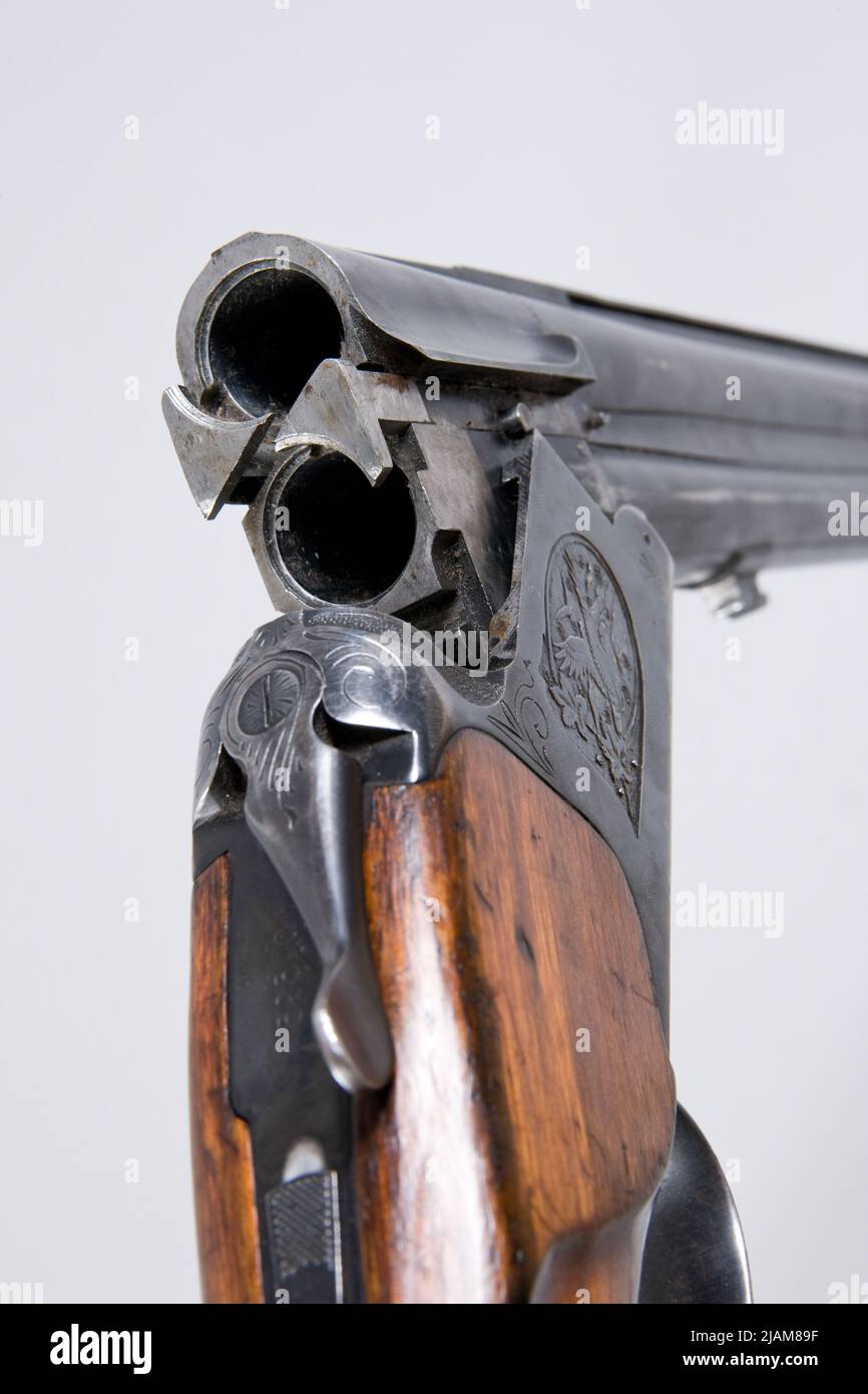 Two lounged hunting shotgun Ż27 E And a mechanical denture Stock Photo ...