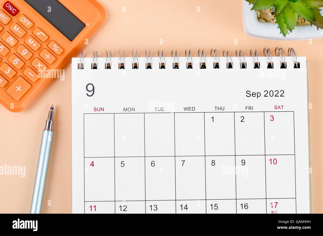 The September 2022 desk calendar with calculator on beautiful ...