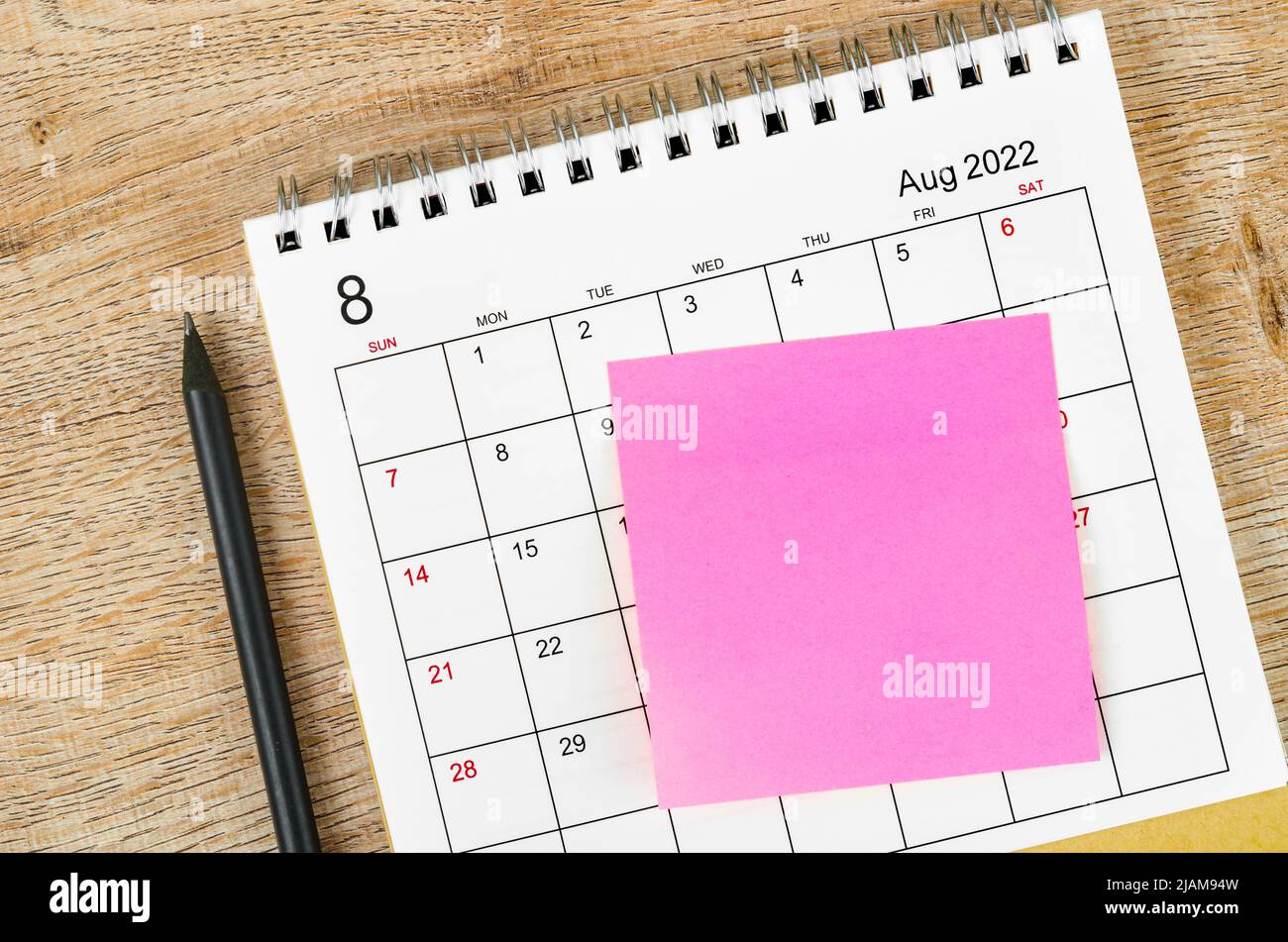The Blank sticky note on August 2022 desk calendar on wooden background ...