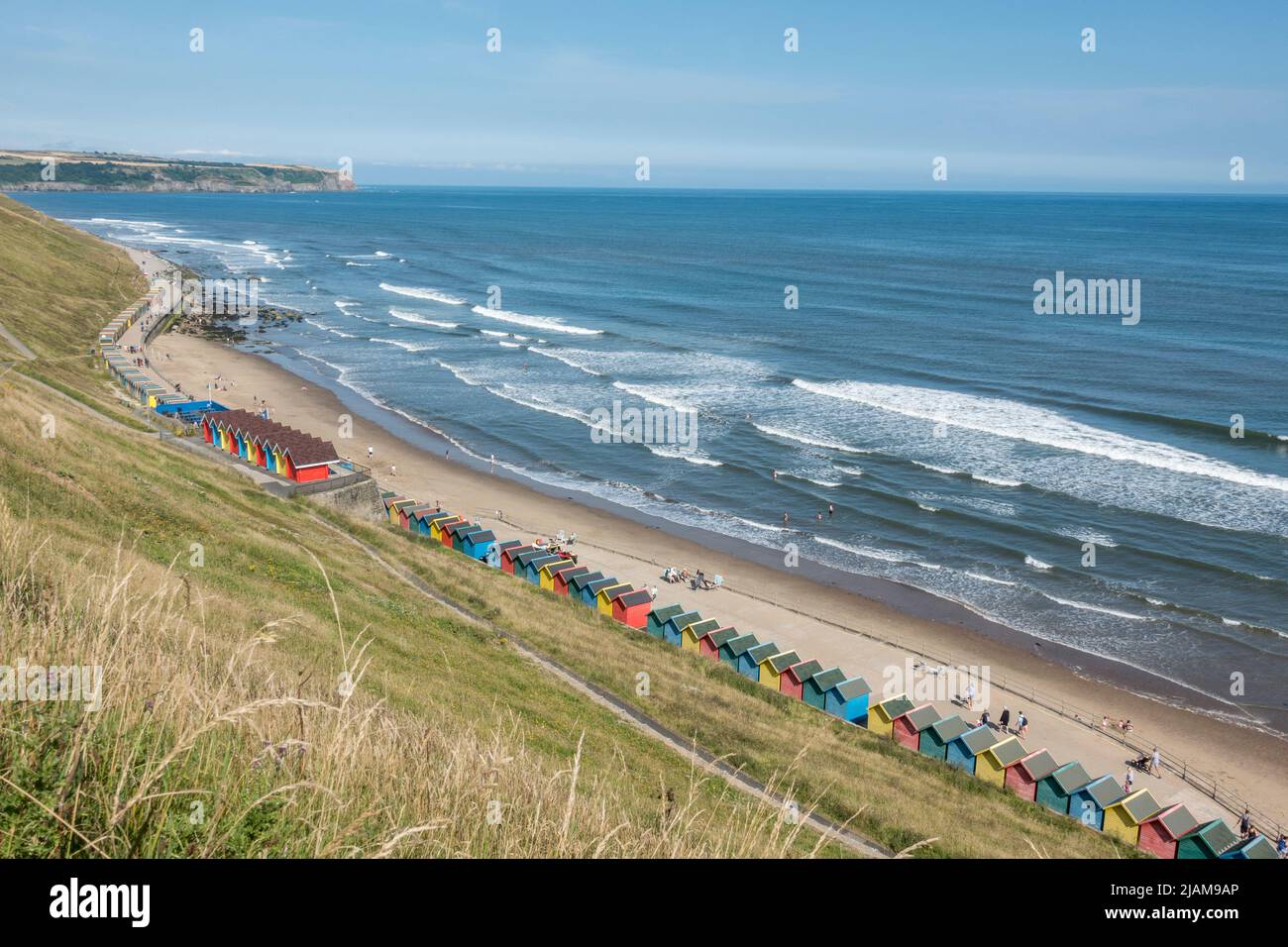 Colourful Whitby Beach Huts on the sea front in Whitby, North Yorkshire ...