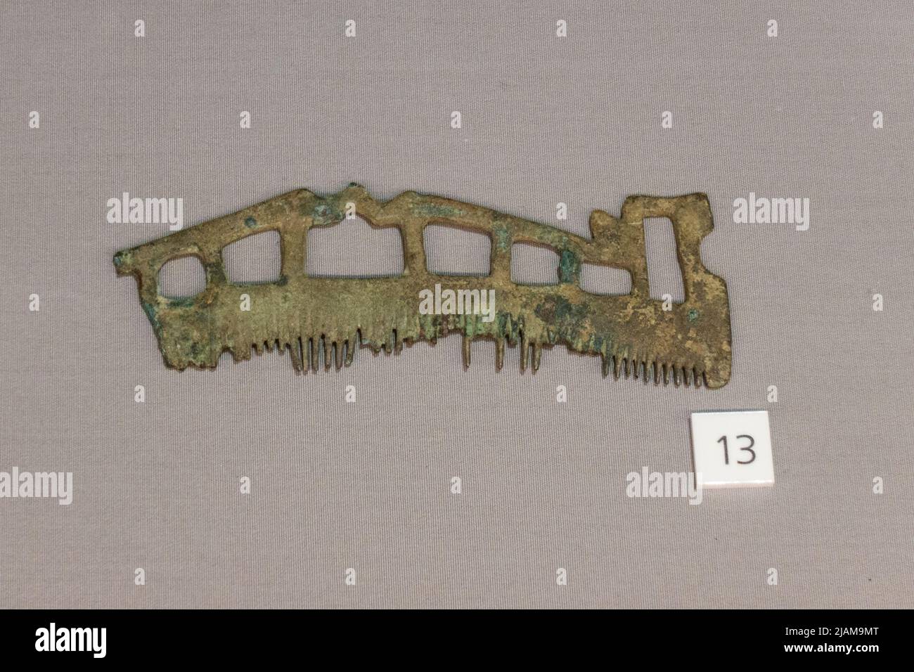 A cast bronze comb, from the Frankish Empire (early 8th cen) on display ...