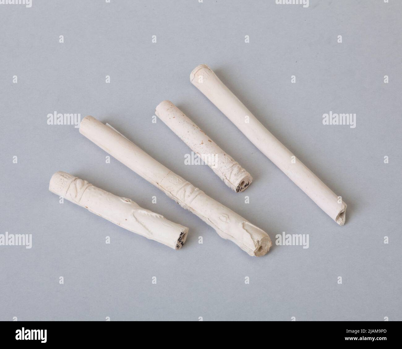 Fragments of uniform pipe stems Stock Photo - Alamy