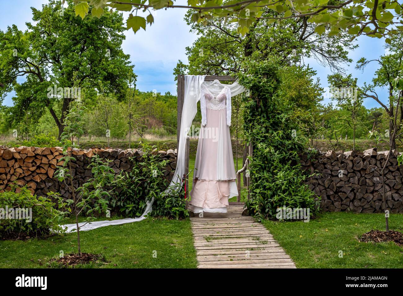 Wedding Dress Of The Bride In The Garden Stock Photo Alamy