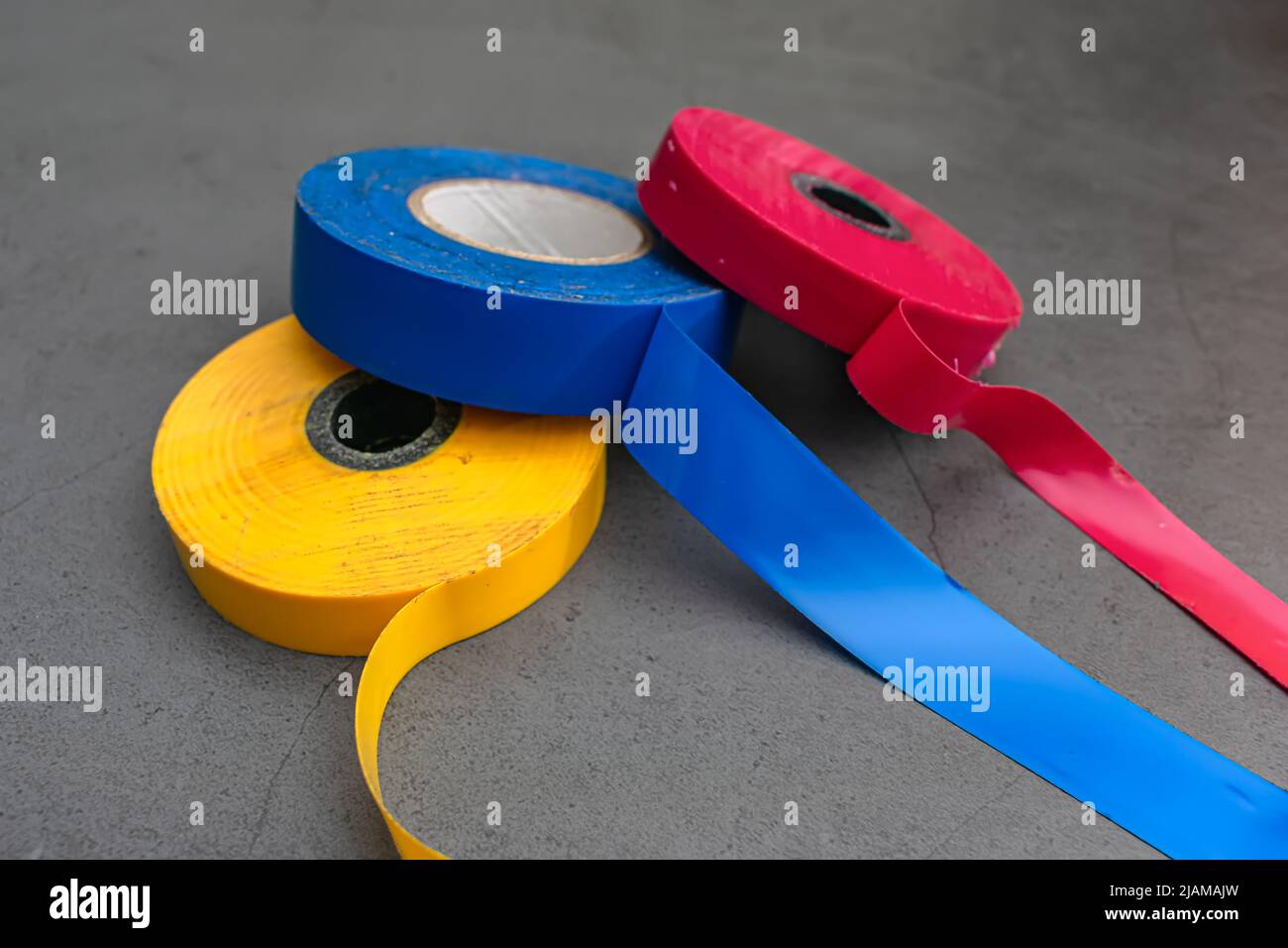 Three pieces of insulating adhesive tape in three colors for different ...