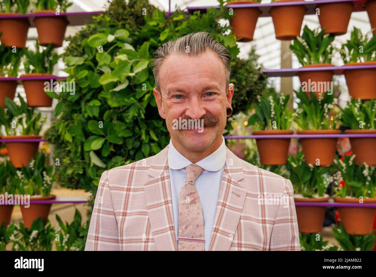 Renowned florist, author and presenter, Simon Lycett, with his display ...