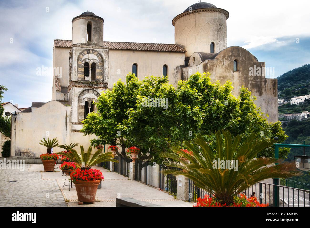 Typical church in small village and colorful flowers in pots Stock ...