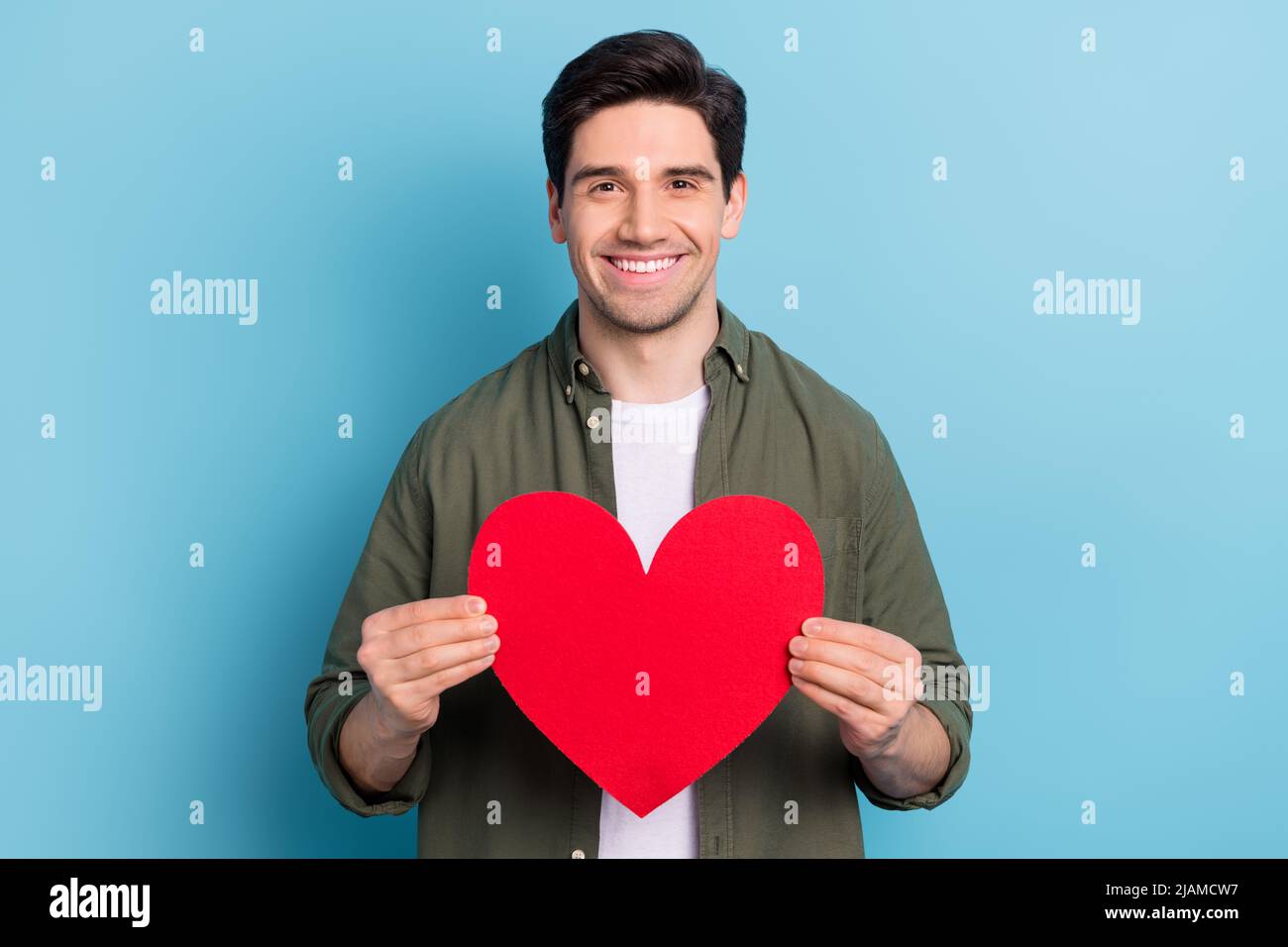 Photo of positive caring guy hold paper heart give present gist his ...