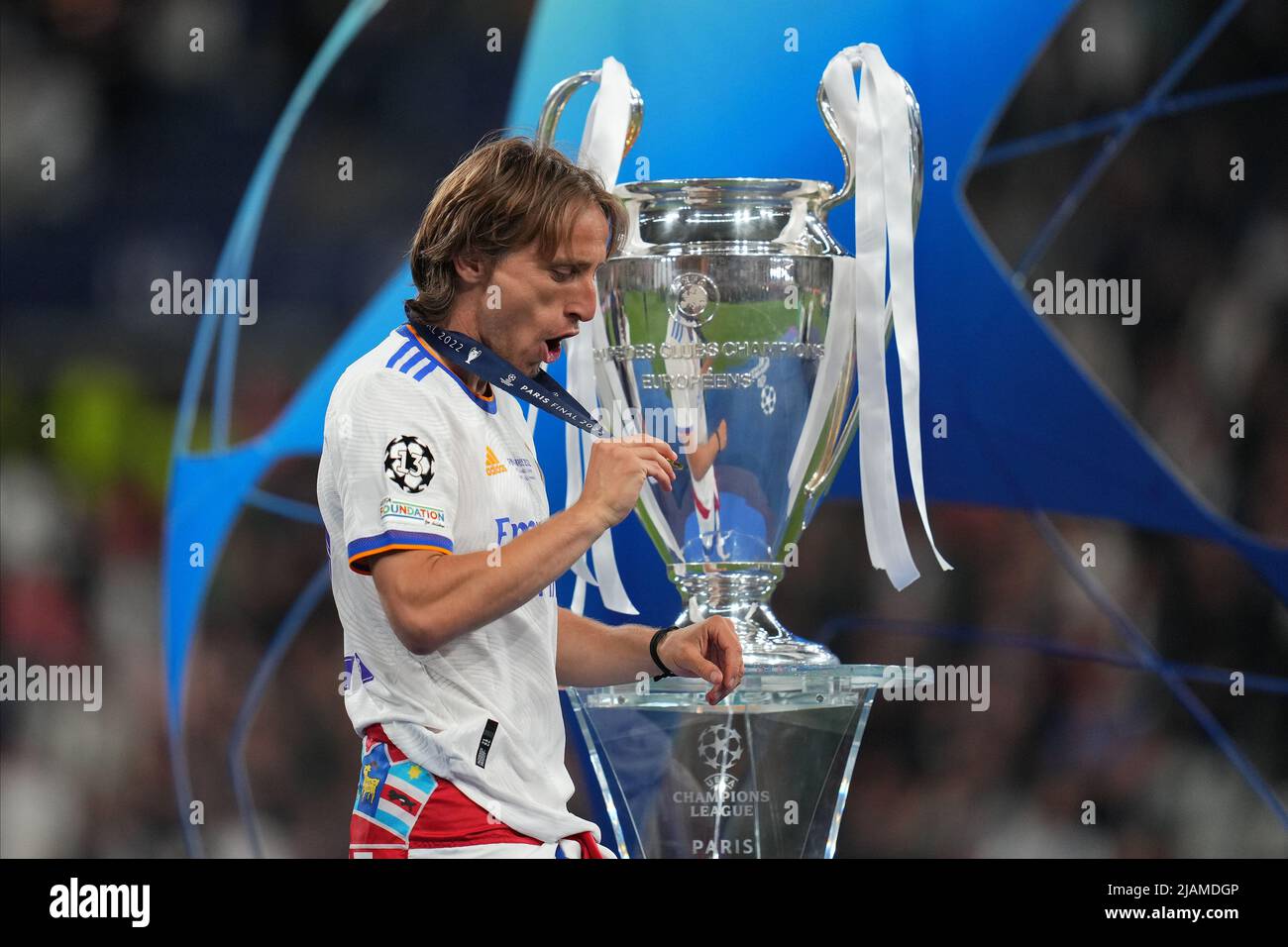 Luka Modric of Real Madrid with the medal and UEFA Champions League ...