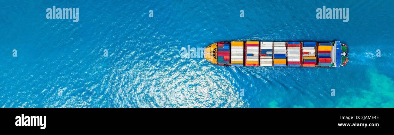 Aerial top view of cargo ship carrying container and running for export ...