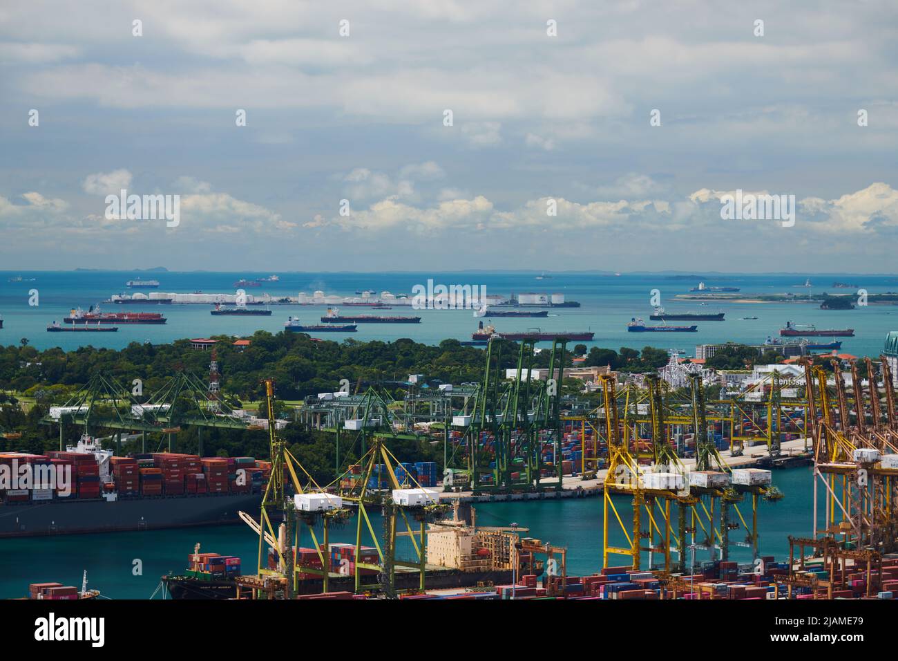 The port of Singapore is the busiest in the world. Seen here lots of ...