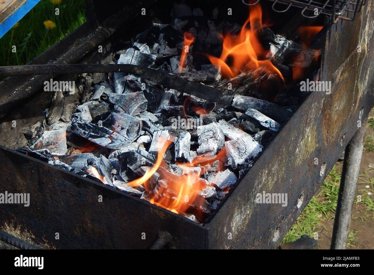 Fire and coals in the barbecue grill Stock Photo - Alamy