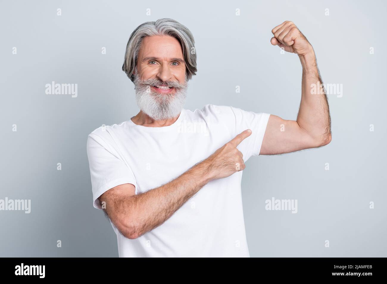 Photo of cute strong man pensioner dressed white t-shirt pointing ...